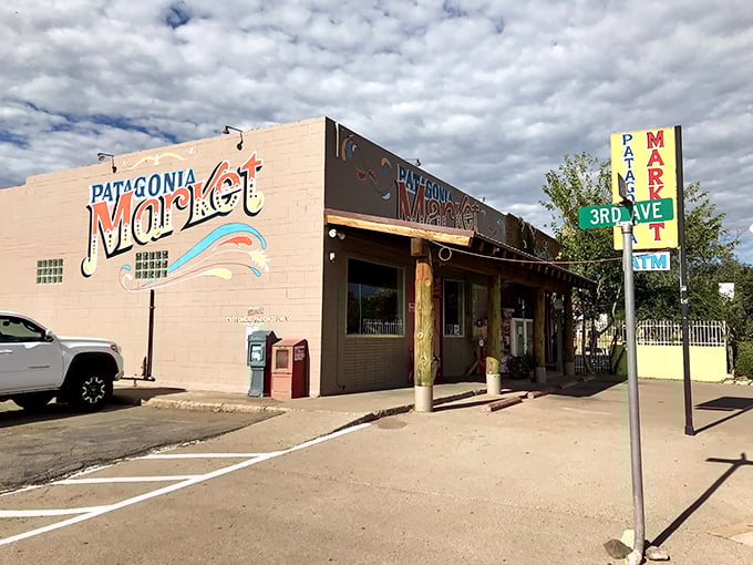 The Patagonia Market's hand-painted sign promises the simple pleasure of groceries without fluorescent lighting or self-checkout machines asking if you've placed an unexpected item in the bagging area.