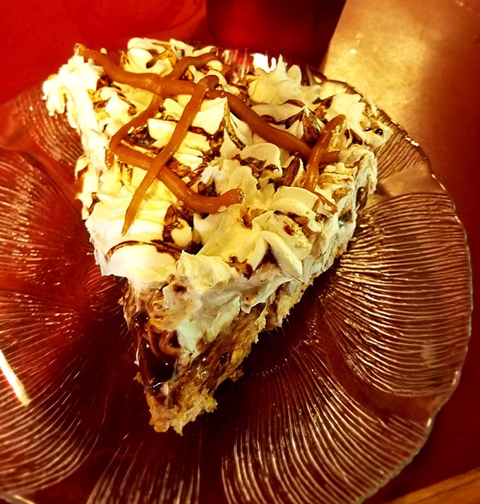 Peanut butter pie that makes you question why you've wasted time on lesser desserts. That drizzle is performing culinary ballet.