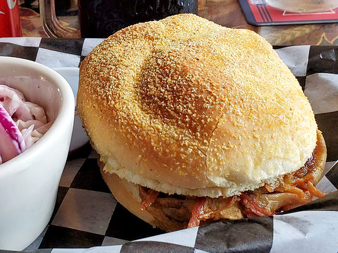 This sandwich isn't just pulled pork&mdash;it's pork that's been coaxed, persuaded, and sweet-talked into tender submission. The pickled onions add just enough zing.