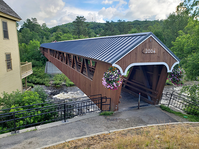 Littleton's covered bridge adorned with flower baskets &ndash; because New Hampshire knows how to dress up its already photogenic infrastructure.