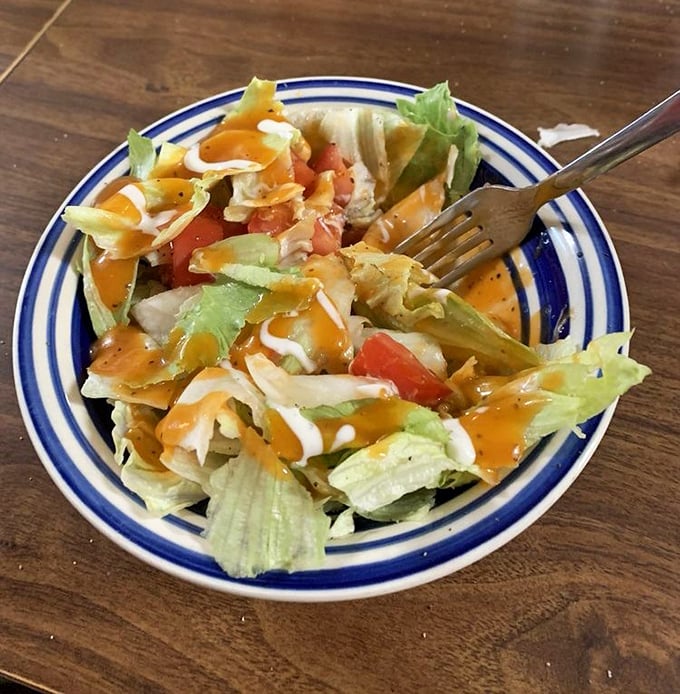 Even the salad has personality here—simple, fresh, and dressed just enough to remind you that vegetables can be more than an obligation.