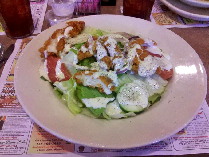 A salad that proves healthy eating doesn't have to be punishment&mdash;crisp greens, grilled chicken, and a drizzle of dressing that ties it all together.