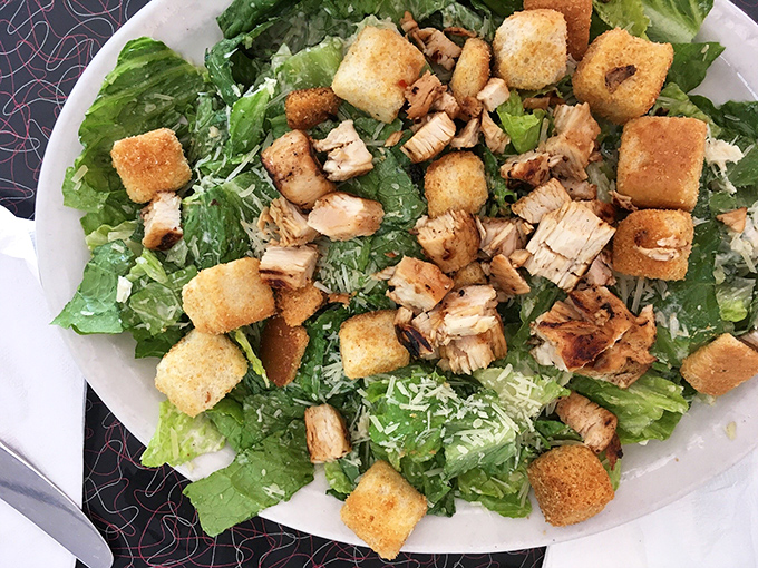 Even the salads here understand comfort food. Crisp lettuce, grilled chicken, and golden croutons prove healthy doesn't mean boring.