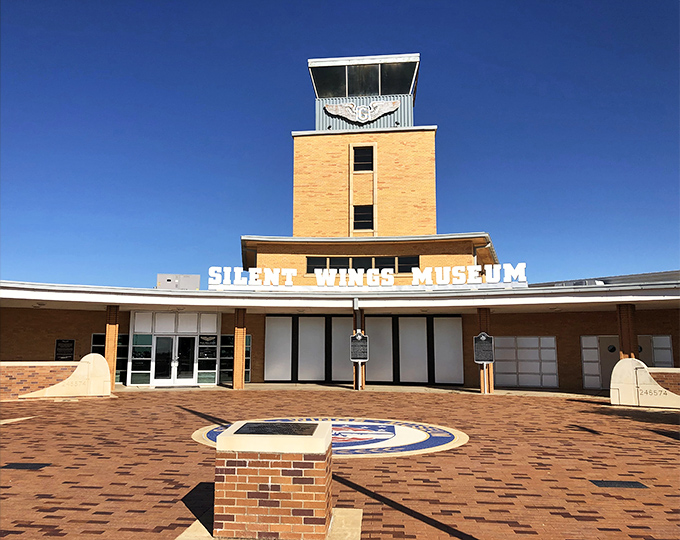 The Silent Wings Museum's distinctive control tower stands as a testament to Lubbock's aviation history. Who knew gliders could be so fascinating after a plate of ribs?