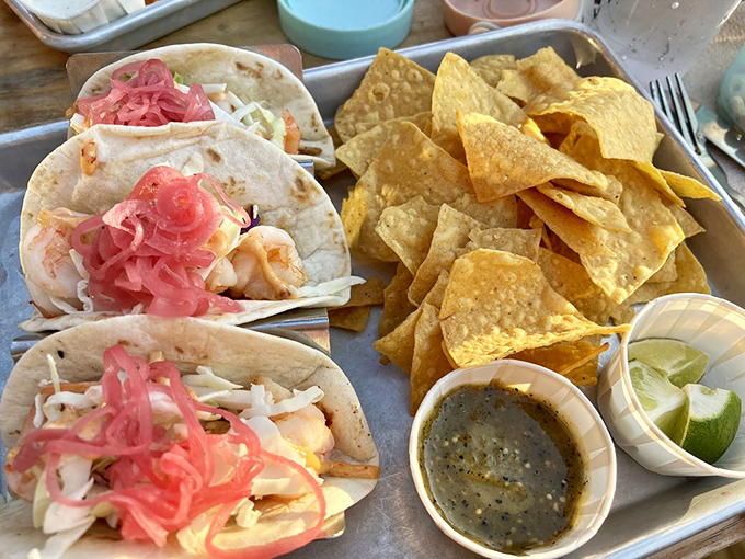 Tacos topped with pickled red onions and served with house-made salsa &ndash; a Texas trinity of flavor, texture, and satisfaction.