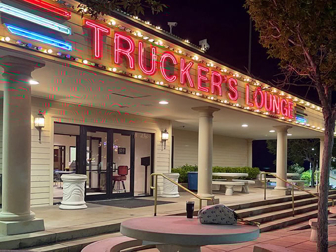 Trucker's Lounge glows with neon promise after sunset. Where locals swap stories, visitors find authentic charm, and nobody's rushing you out.