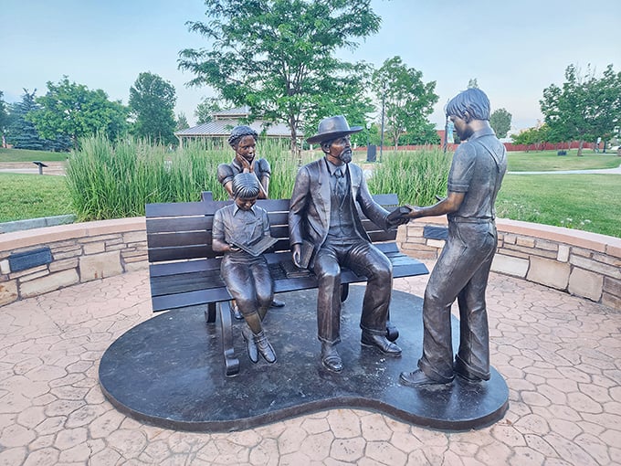 Public art that doesn't try too hard&mdash;Whitney Commons Park's bronze figures capture that rare moment when history feels less like homework and more like family.