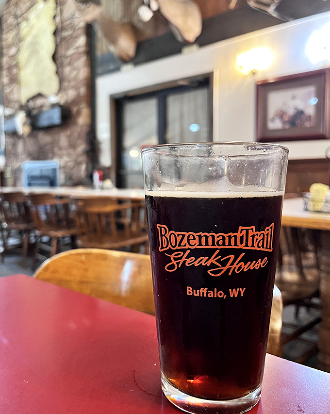 A glass of amber goodness bearing the Bozeman Trail name &ndash; because nothing complements Wyoming beef like a properly poured local brew.