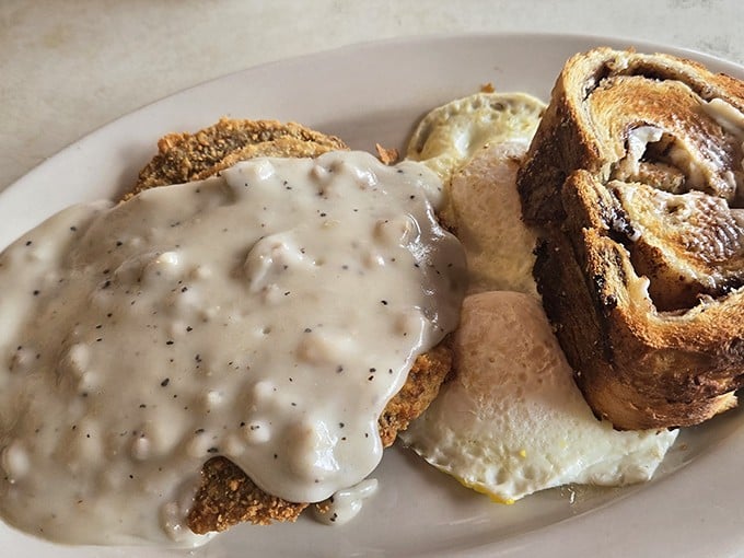 Country-fried steak smothered in peppery gravy alongside sunny-side-up eggs—a breakfast that says, "Go ahead, skip lunch. I've got you covered."
