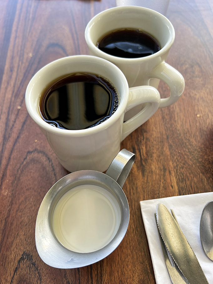 Two cups of coffee that promise to transform you from morning zombie to functioning human. The elixir of breakfast champions.