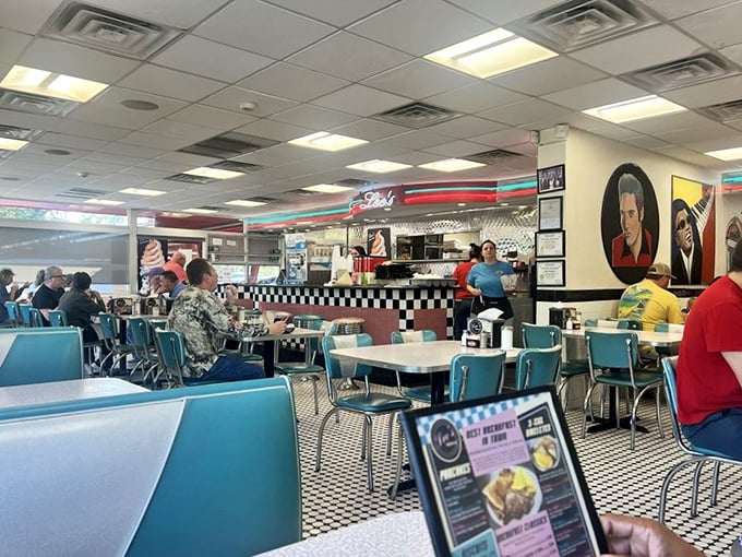 The dining area hums with conversation and clinking silverware, a community gathering spot where strangers become neighbors over coffee refills.
