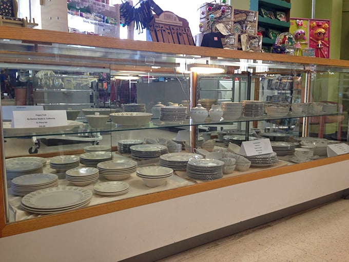 Fine china behind glass&mdash;because someone's wedding registry castoffs deserve a second chance at hosting memorable dinner parties and Sunday brunches.