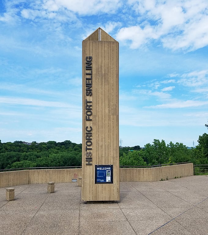 The entrance monument announces your arrival with understated Midwestern elegance, standing beneath a tree that's clearly dressed for fall's grand gala.