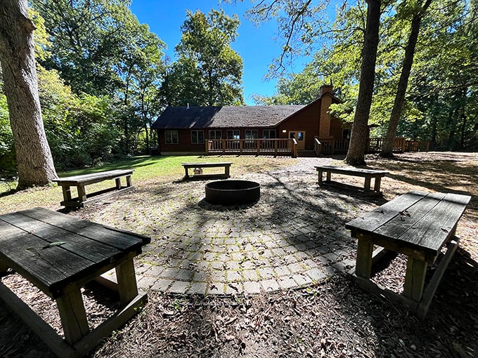 Campfire conversations waiting to happen. These rustic benches have heard countless ghost stories, family memories, and the occasional dad joke.