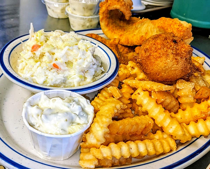 Coleslaw that knows its role, tartar sauce standing by, and golden fish that shatters at first bite. This is why people drive across county lines.
