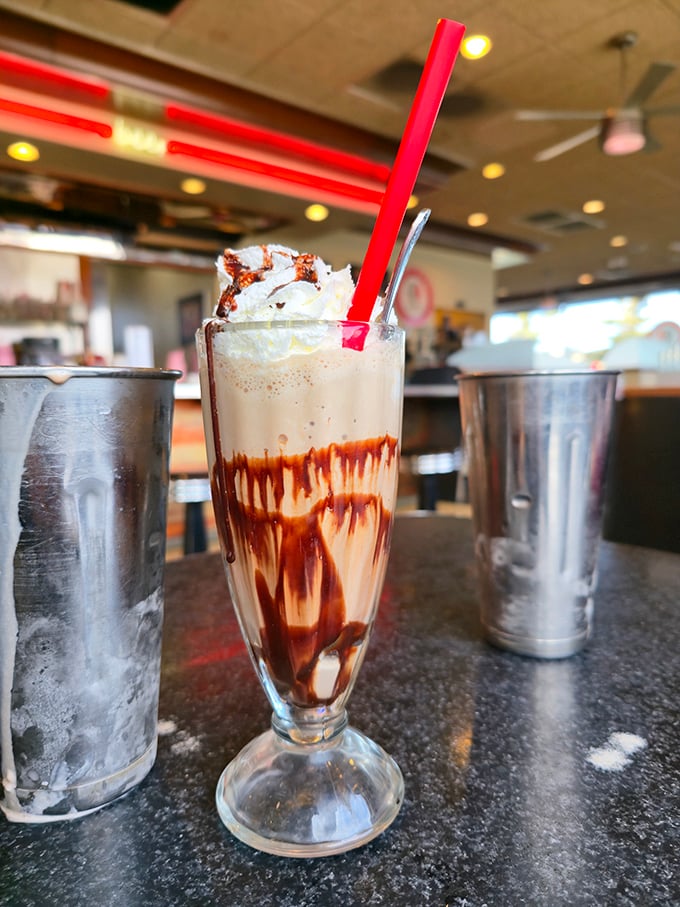 This isn't just a milkshake; it's a drinkable dessert masterpiece with the bonus metal mixing cup on the side&mdash;because one serving is never enough.
