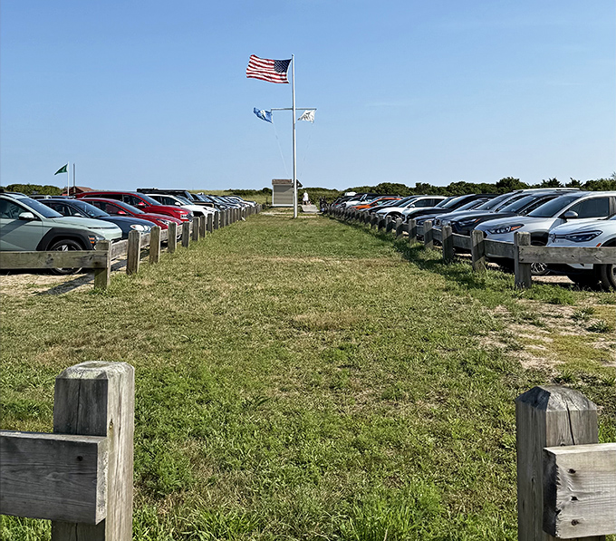 The parking lot at East Beach &ndash; where American flags flutter overhead and cars line up like eager beachgoers waiting for their first glimpse of Atlantic paradise.