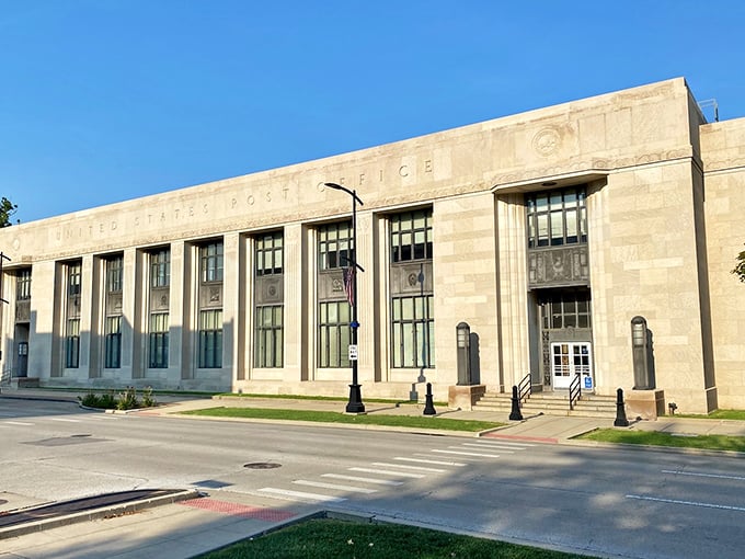 Historic United States Post Office building stands majestically against clear blue sky, showcasing classic Art Deco architecture.