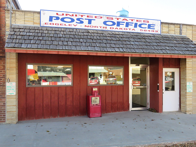 The post office&mdash;where mail still matters and the red wooden facade feels like a warm handshake. Small-town communication central, no algorithms required.
