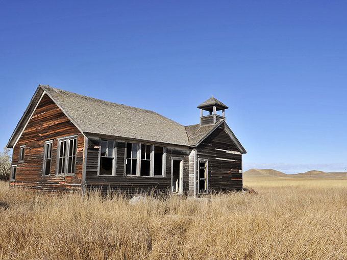 Time stands still at Griffin's schoolhouse, where the bell tower still reaches hopefully toward the endless Dakota sky.