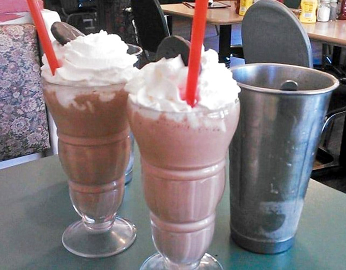 Milkshakes topped with whipped cream and Oreos&mdash;proof that sometimes drinking your dessert is the most adult decision you can make.