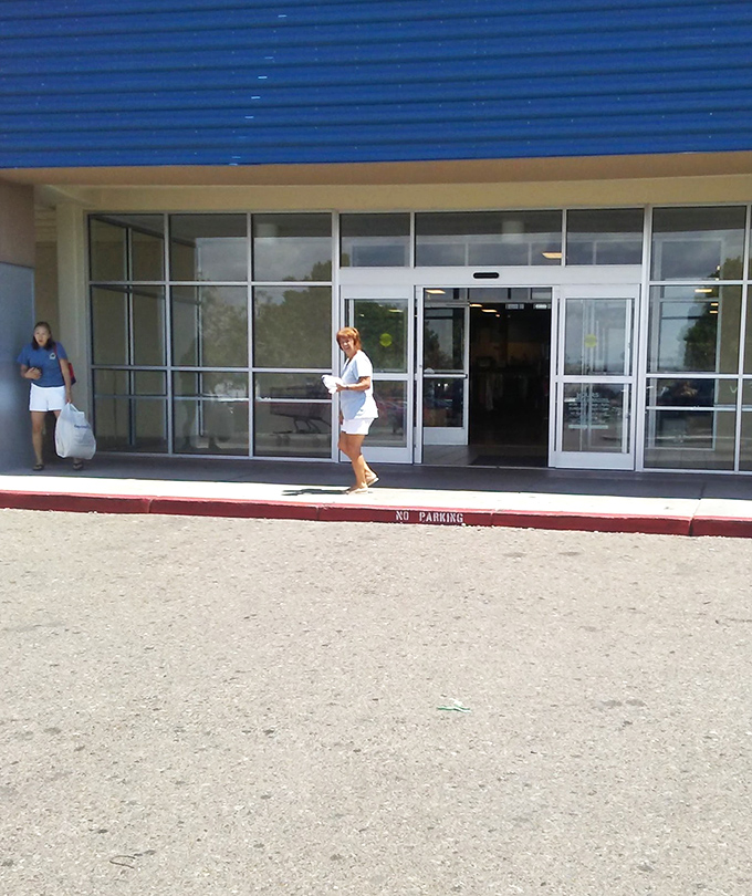 Shoppers exit with treasures in hand, proof that one person's donations become another's discoveries. The circle of retail life continues!