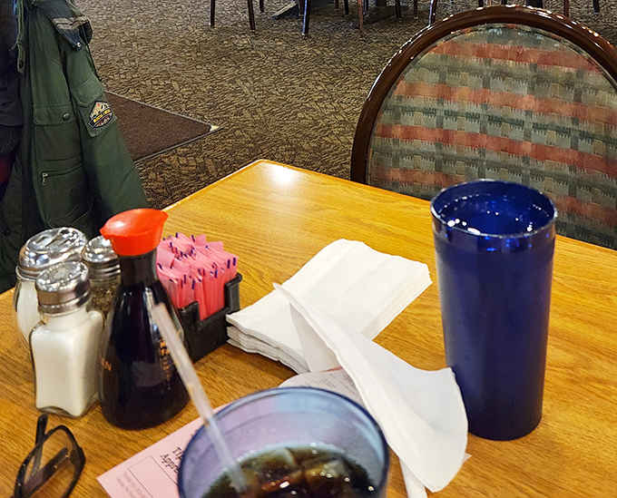 Every table comes equipped with the essentials: soy sauce for dipping, napkins for inevitable spills, and drinks large enough to combat buffet thirst.