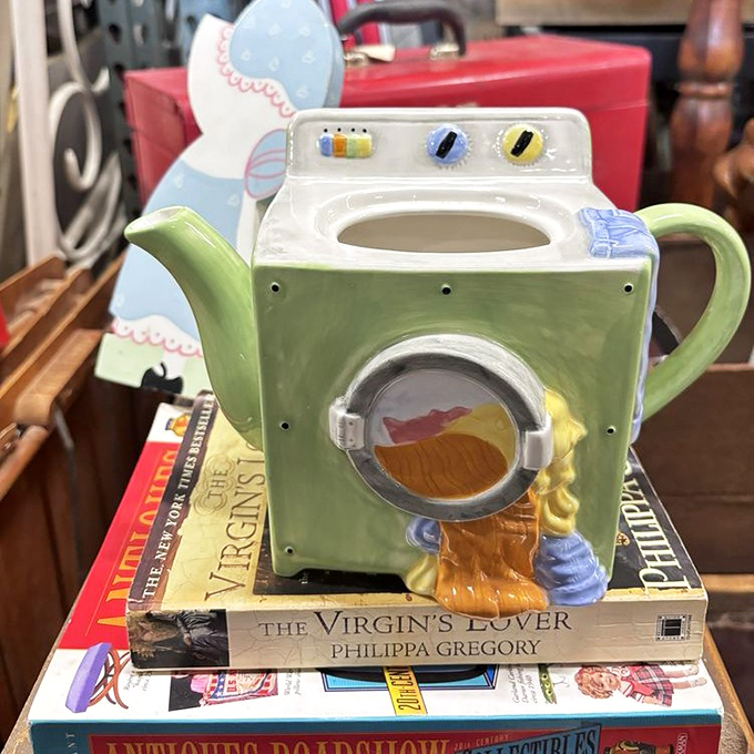 A whimsical washing machine teapot sits atop literary classics &ndash; proving that in the antique world, unexpected pairings create the best stories.