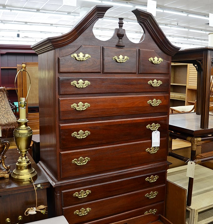 This mahogany highboy dresser with brass pulls would cost a fortune new. Here, it's just waiting for someone to appreciate its timeless craftsmanship.