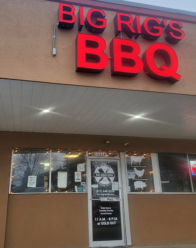Big Rig's bold red sign cuts through the night like a beacon, guiding hungry travelers to BBQ salvation.