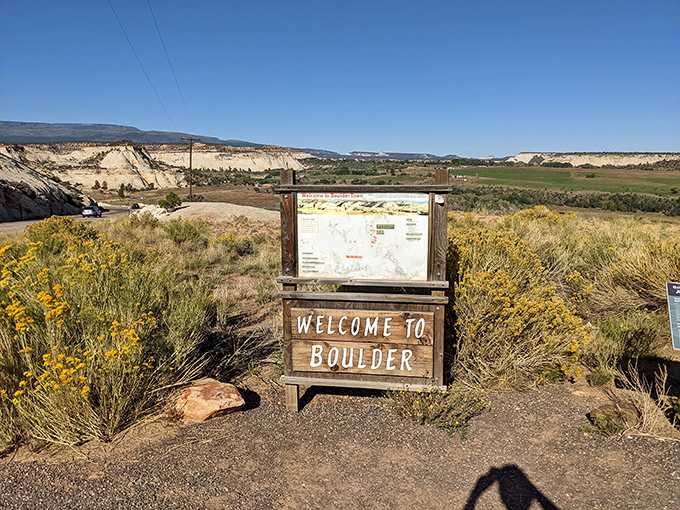 Welcome to Boulder! This unassuming sign marks the entrance to one of Utah's best-kept secrets, where isolation has preserved both landscape and lifestyle.