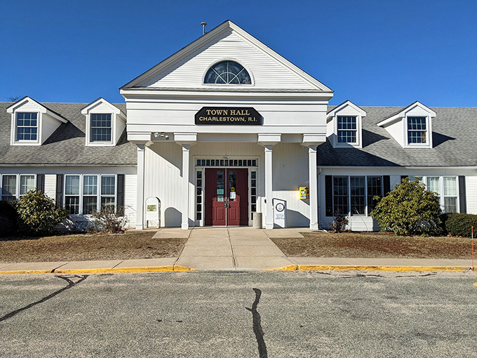 Charlestown's Town Hall stands proud and white, proving that small-town government buildings can have serious architectural style and grace.