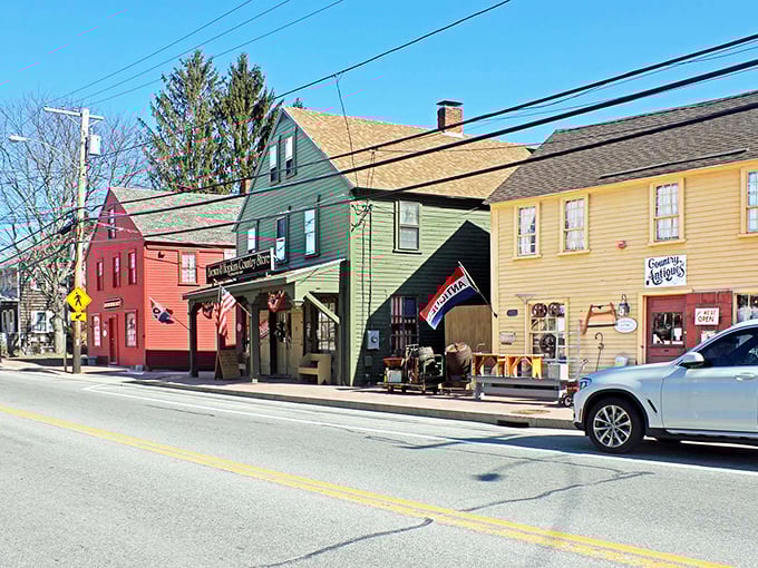 Colorful historic buildings line the charming main street in Glocester, showcasing the town's vibrant small-town character and local businesses.