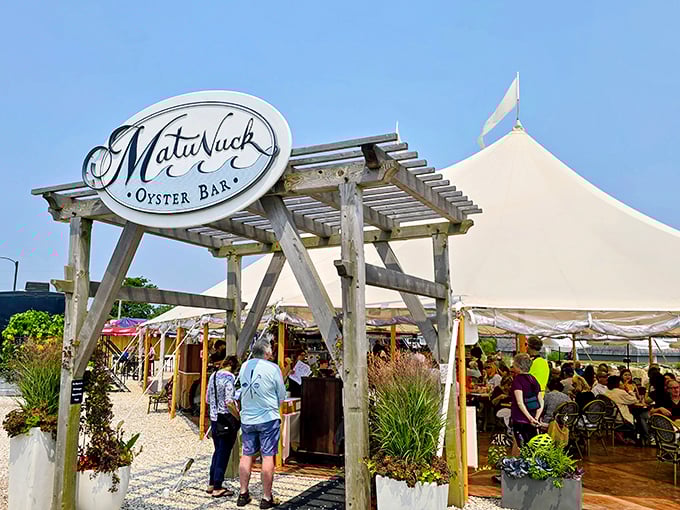 Matunuck's rustic entrance arch welcomes seafood pilgrims to this farm-to-table paradise where oysters journey mere feet from pond to plate.