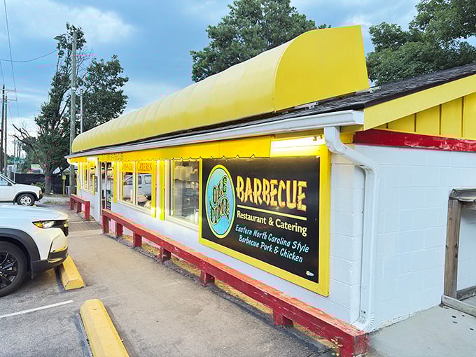Ole Time Barbecue's sunny yellow awning brightens the roadside like a barbecue oasis. That cheerful exterior promises comfort food that hugs your soul.