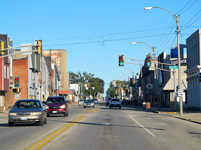 Olney's wide main street welcomes visitors with historic storefronts and that classic small-town charm under clear blue skies.
