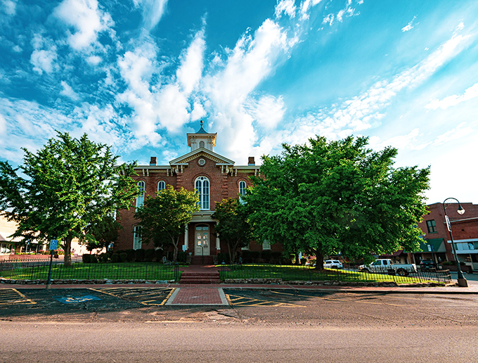 Pocahontas's beautiful historic courthouse stands proudly surrounded by mature trees, creating a perfect small-town square atmosphere for visitors.