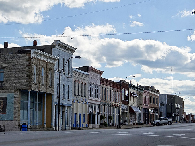 Sedan's quiet main street whispers stories of busier times when these storefronts buzzed with activity from dawn to dusk.