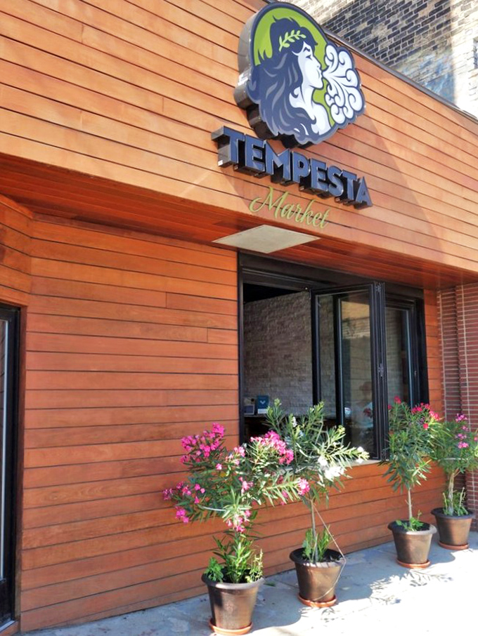 Warm wooden facade as inviting as the sandwiches within. Those flower pots promise care in everything they create.