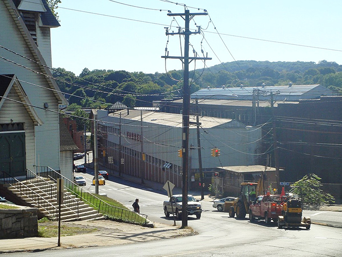 The view from Ansonia's hillside reveals a compact, walkable downtown where the community has gathered, shopped, and connected for generations without needing car keys.