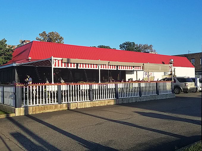 Red roof, white fence, and the blues of BBQ cravings satisfied &ndash; this place is as American as smoked ribs and secret sauce.