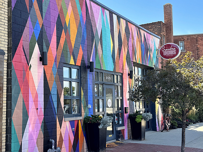 Pizza with artistic flair starts with a building that isn't afraid of color. This mural is the visual equivalent of "we don't do boring here."