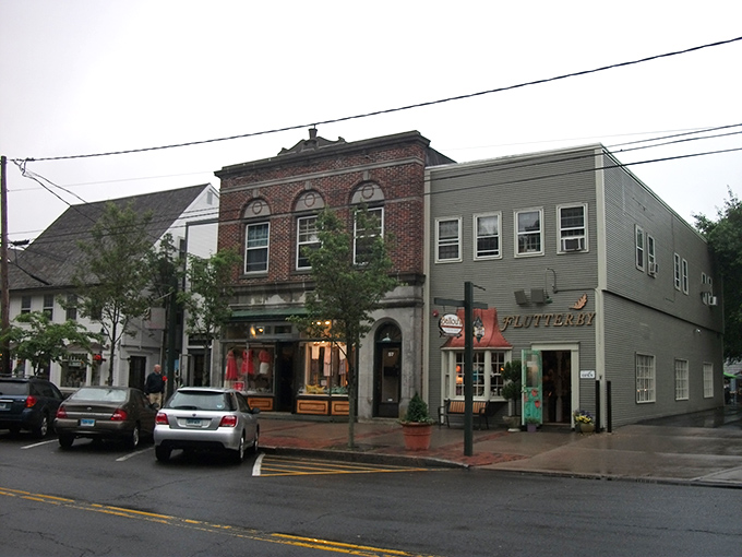 Guilford's historic brick buildings house unique shops perfect for window shopping during a wallet-friendly Connecticut day trip.