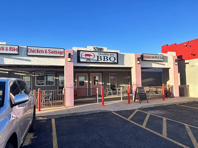 Simple signage, complex flavors. This pink-trimmed BBQ joint specializes in meat magic worth the drive.