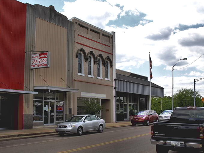 Historic storefronts line Milan's Main Street, where affordable small-town charm meets modern convenience.