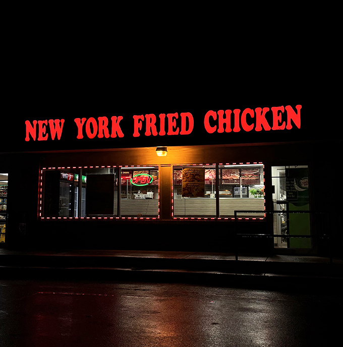 Red neon cutting through the darkness like a lighthouse for late-night chicken cravings and hungry souls.