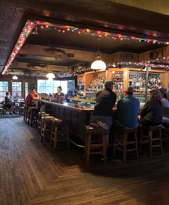 Twinkling lights and a cozy wooden bar create the perfect atmosphere for enjoying Twin Falls' best steaks.