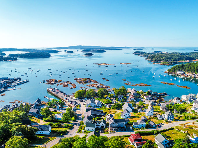 The aerial view of Stonington reveals a coastal gem where island living comes without requiring a hedge fund manager's salary.