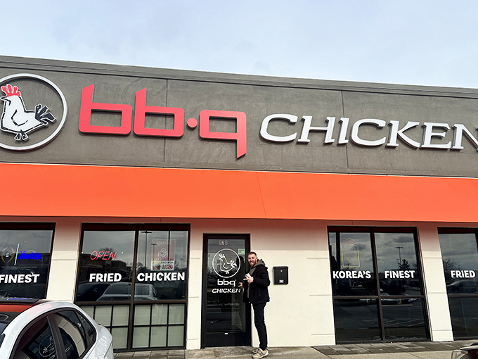 The bright orange awning at bb.q Chicken signals a delicious departure from traditional fried chicken &ndash; crispy, Korean-style magic awaits.