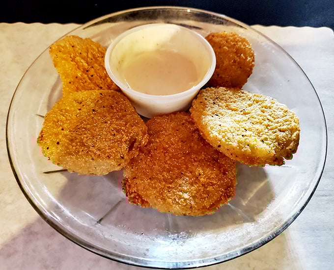 Fried green tomatoes that achieve the impossible: crispy golden exteriors giving way to tangy centers&mdash;the Southern appetizer that makes vegetables feel like an indulgence.